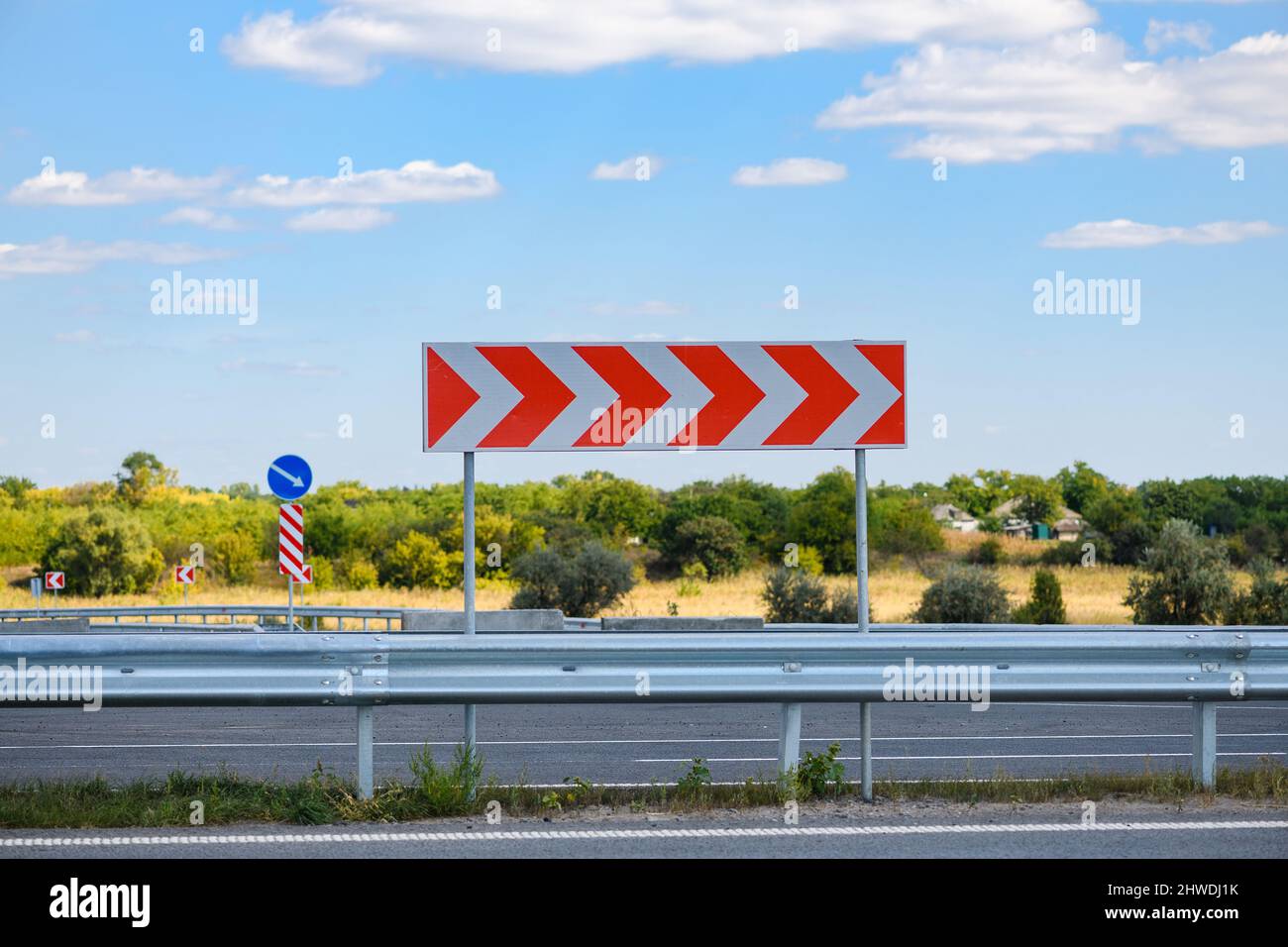 Right Turn Sign. Road signs warn of a sharp turn Stock Photo - Alamy