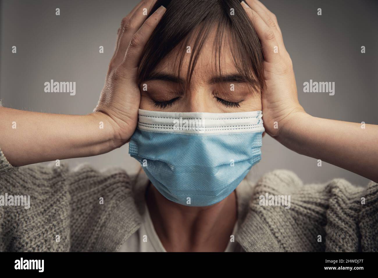 Woman worried and stressed about being infected with Covid-19 Stock ...