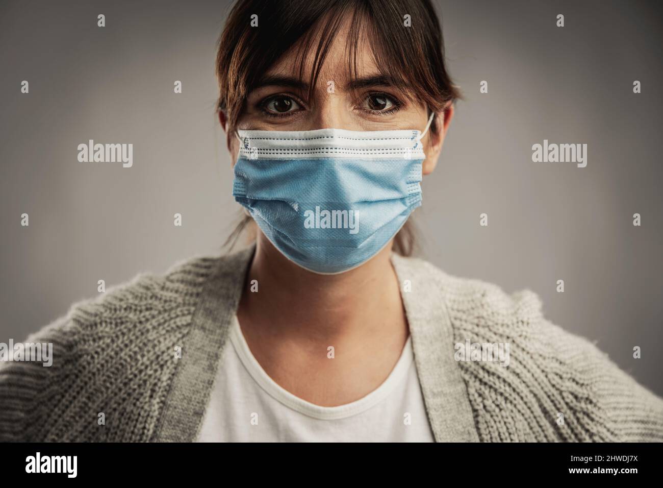 Woman worried and stressed about being infected with Covid-19 Stock ...