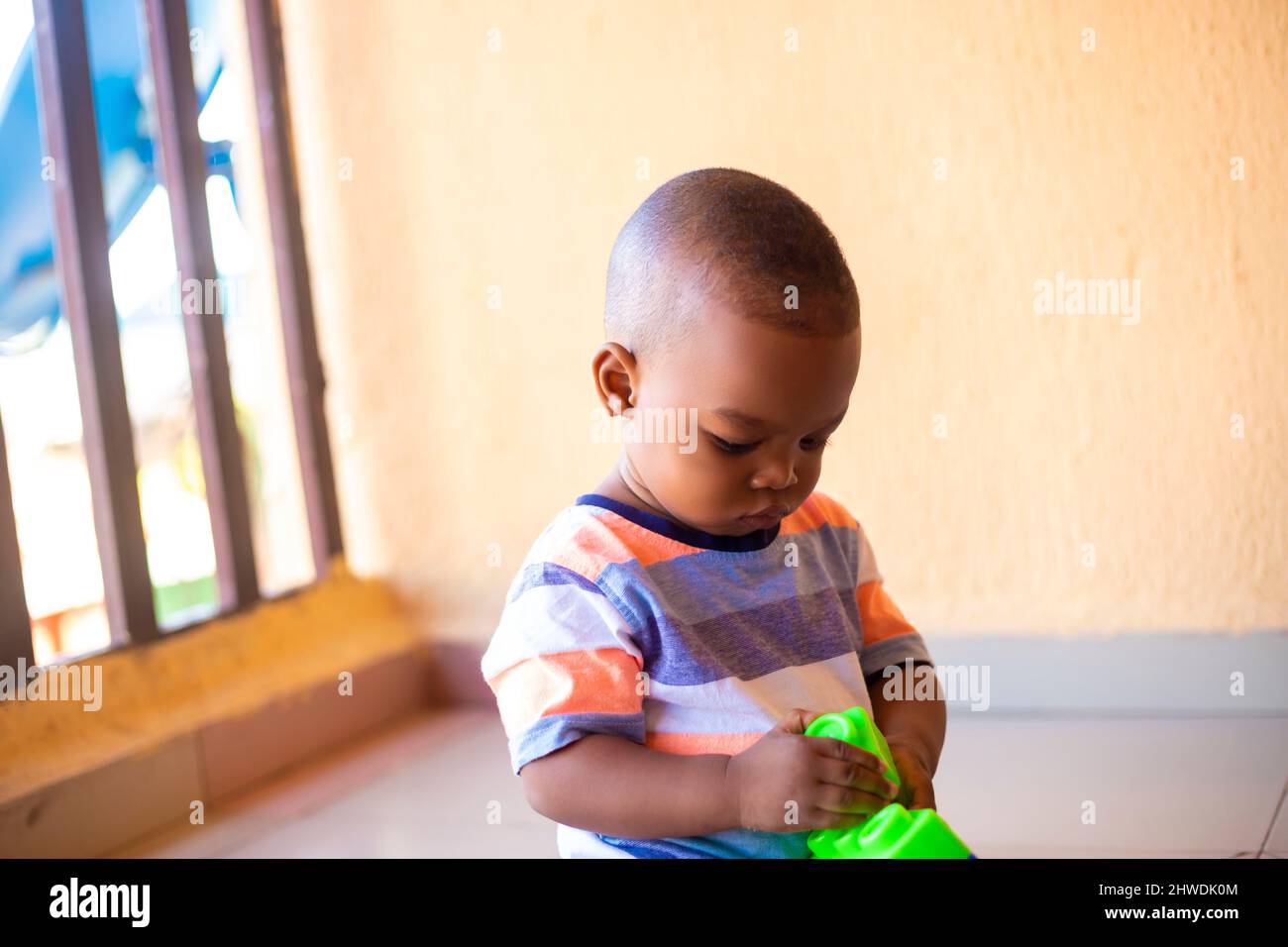 Cute little boy play with building bricks in preschool Stock Photo - Alamy