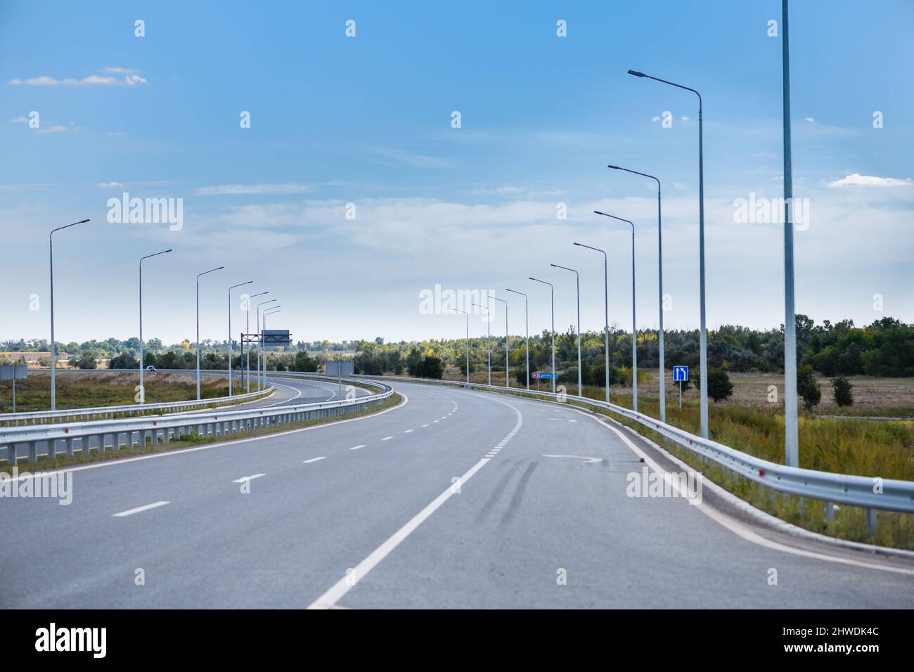 View of an empty highway with road lines and road signs Stock Photo - Alamy