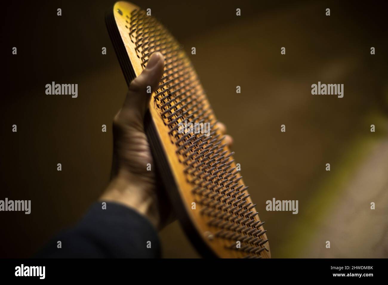 Board with nails. Tool for practicing yoga. Small nails stick out of ...