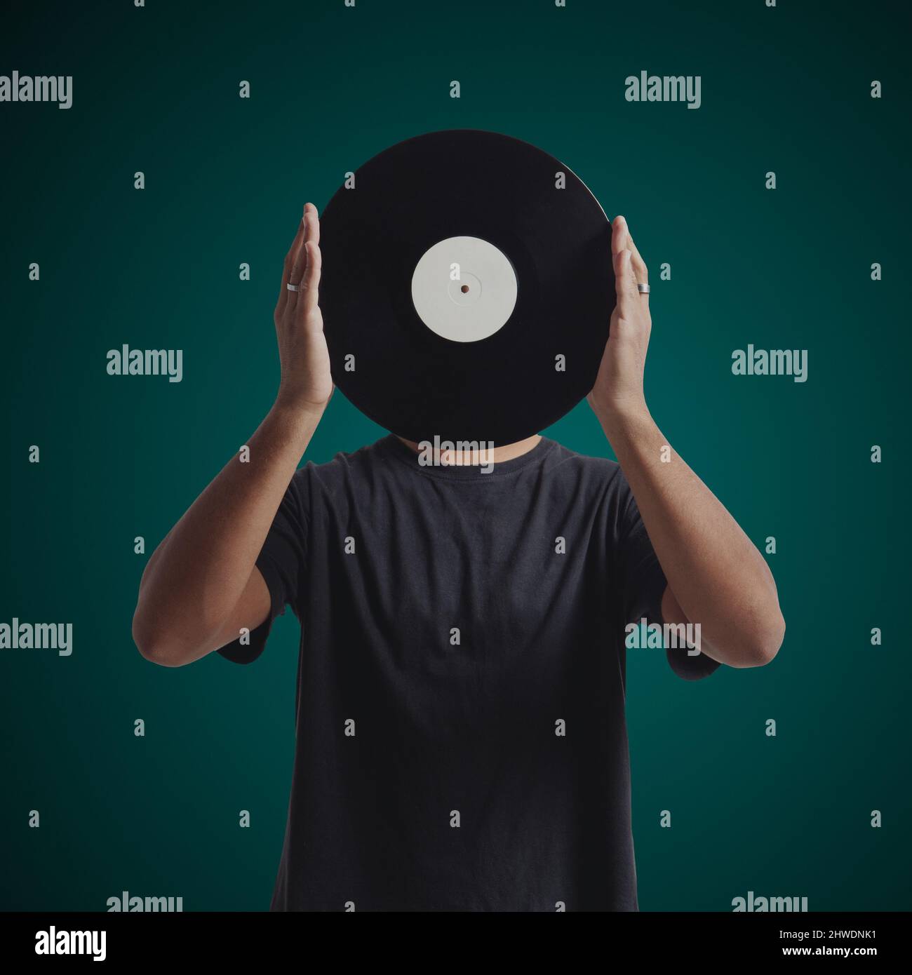 Holding album in front of face hi-res stock photography and images - Alamy