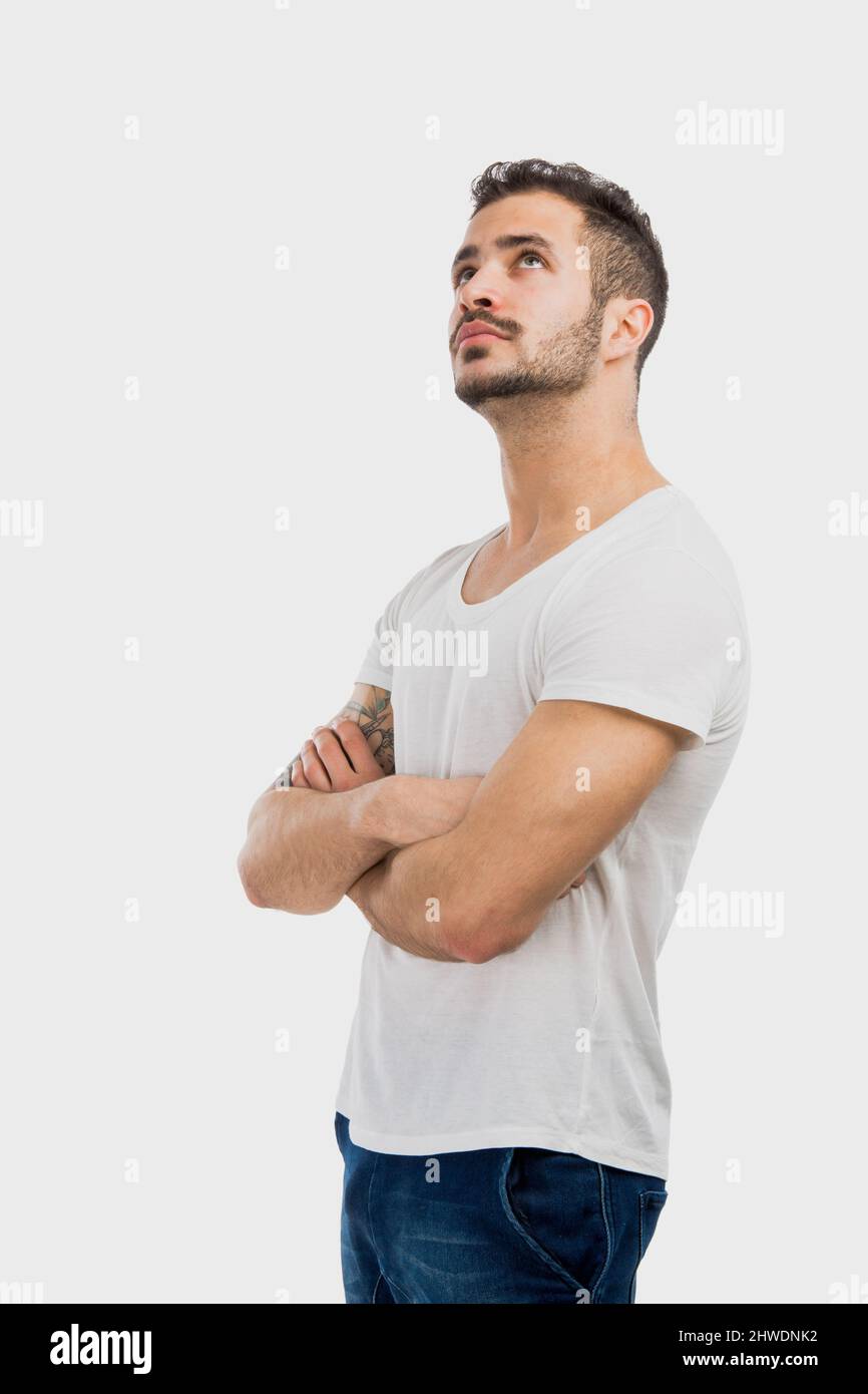 Studio portrait of a man thinking Stock Photo - Alamy