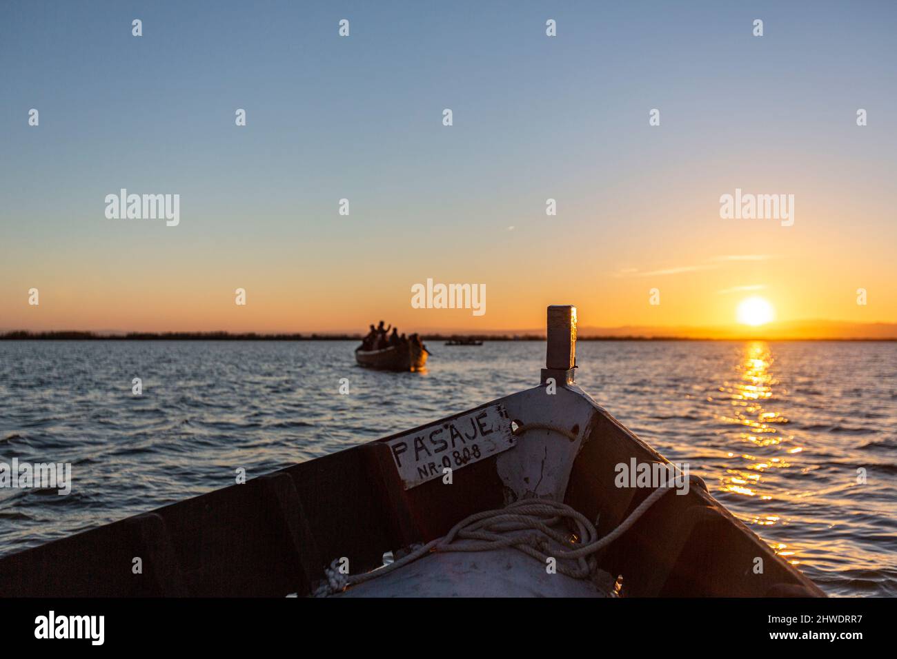 Tourist boat trip during sunset on the Albufera lagoon. La Albufera ...