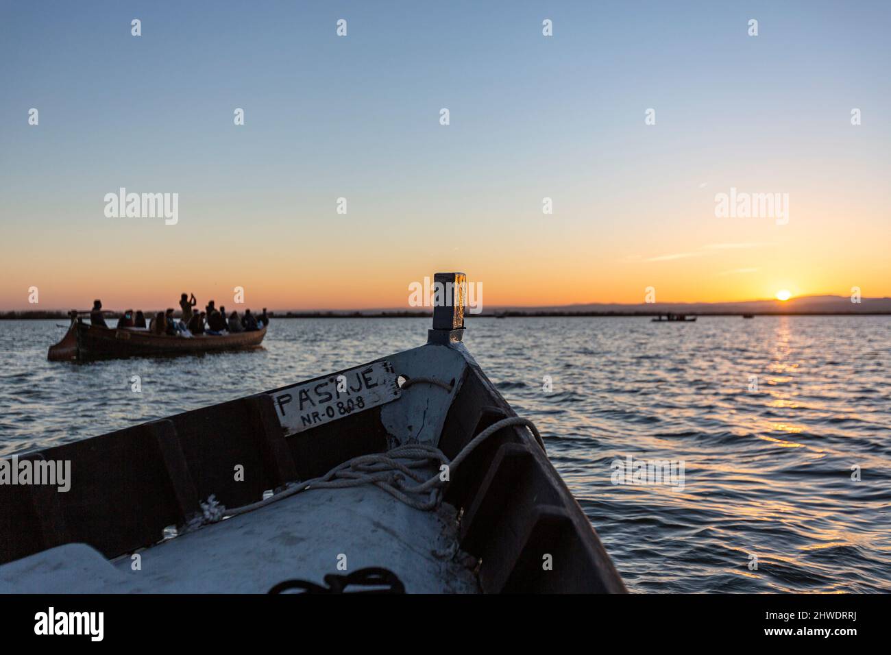 Tourist boat trip during sunset on the Albufera lagoon. La Albufera ...