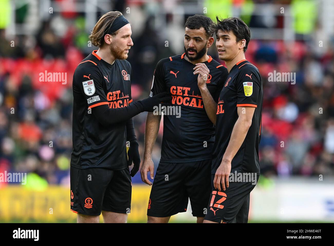 Josh Bowler #11, Kevin Stewart #6 and Kenny Dougall #12 of Blackpool ...