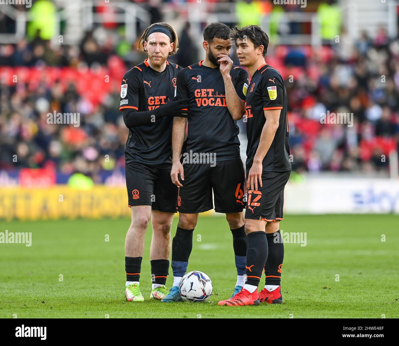 Josh Bowler #11, Kevin Stewart #6 and Kenny Dougall #12 of Blackpool ...