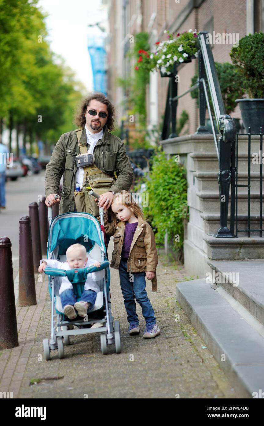 Young father and his two kids having a good time in Amsterdam ...