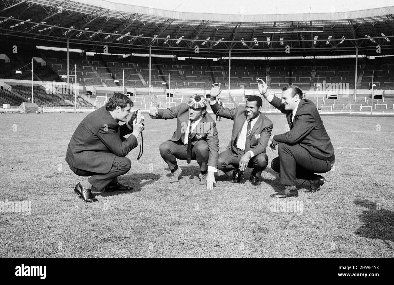 Salford Red Devils rugby league team members inspect the pitch at ...