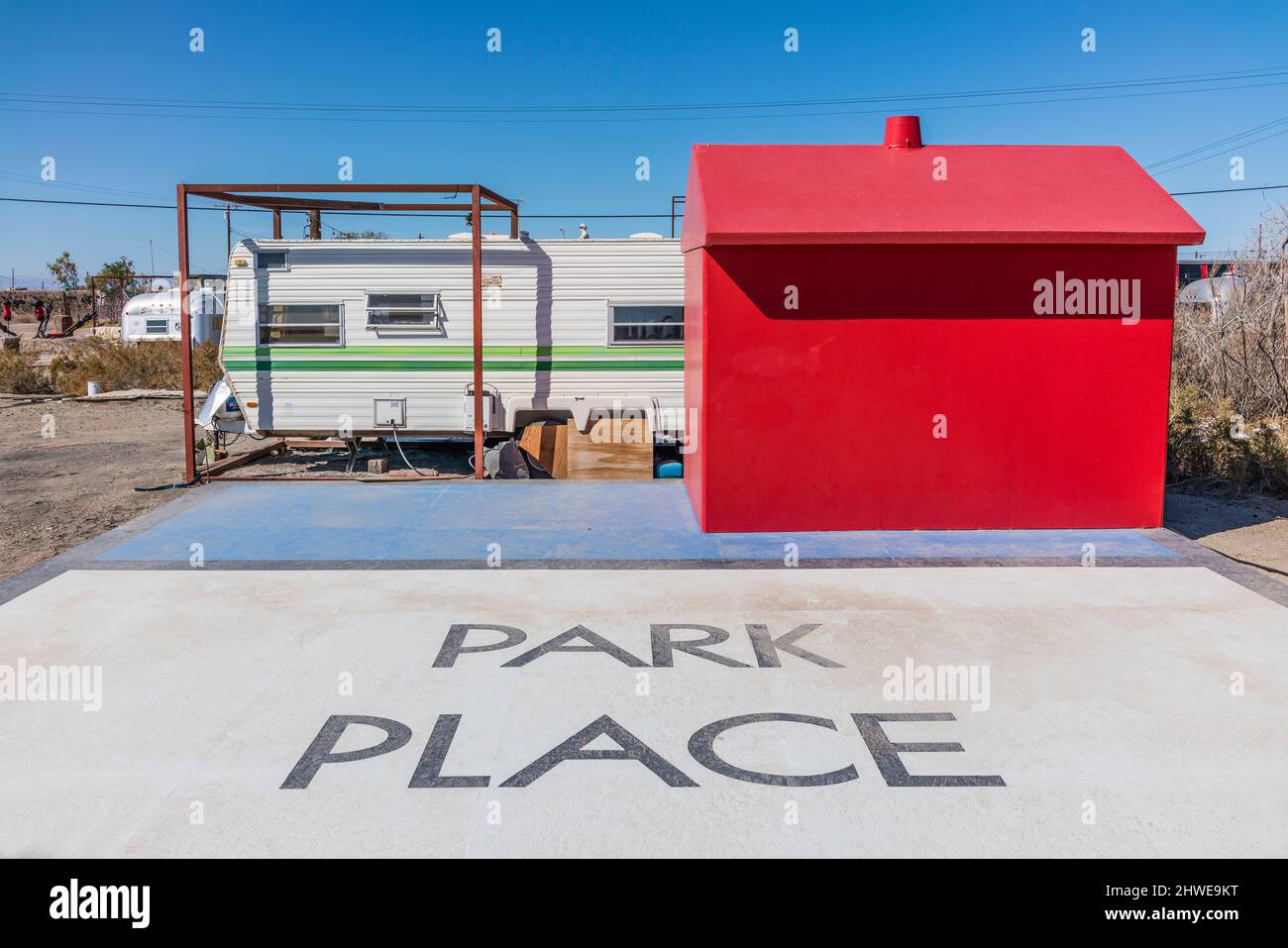 A life-sized Monopoly hotel on a concrete pad with "Park Place" painted ...