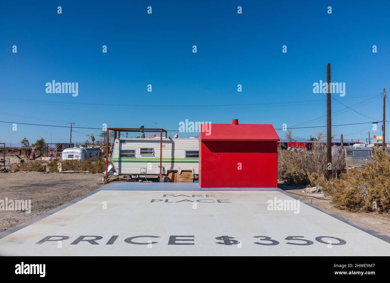 A life-sized Monopoly hotel on a concrete pad with "Park Place" painted ...