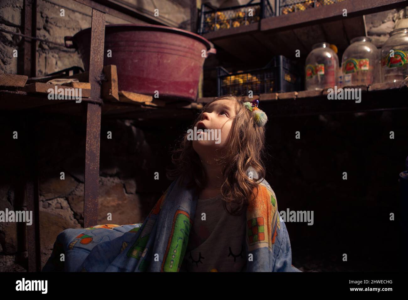 Ukrainian kid takes shelter in her basement. Stop war Stock Photo - Alamy