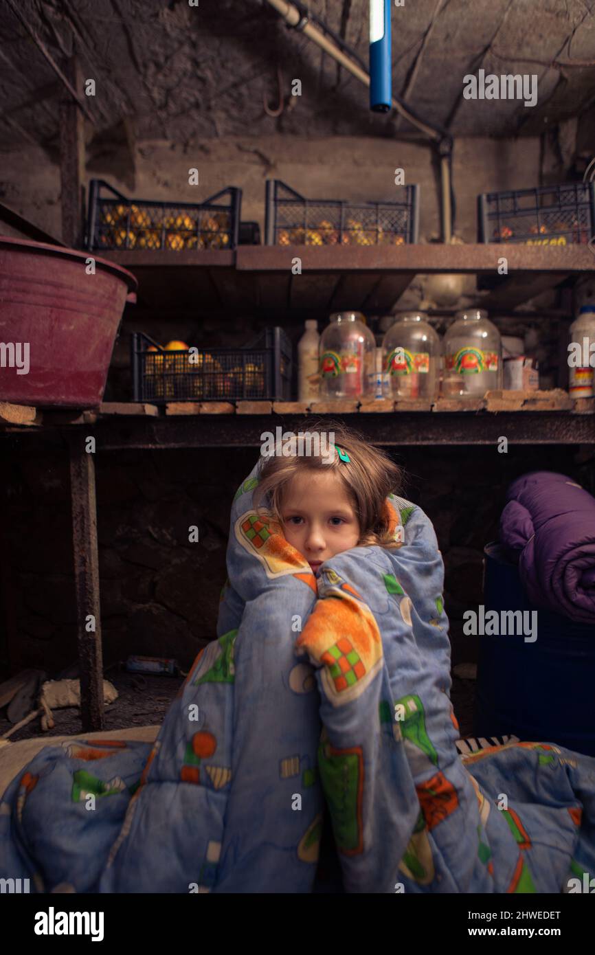 Ukrainian girl takes shelter in her basement. Stop war Stock Photo - Alamy