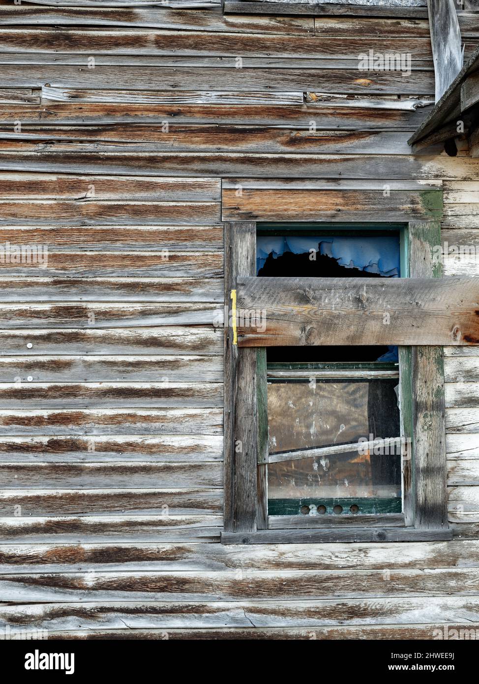 Gray weathered boards siding and window rustic Stock Photo - Alamy