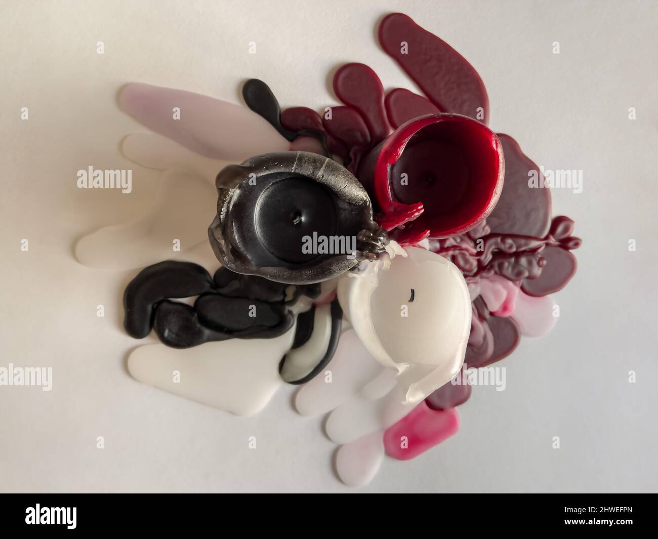 top view of several molten candles of different colors, background ...