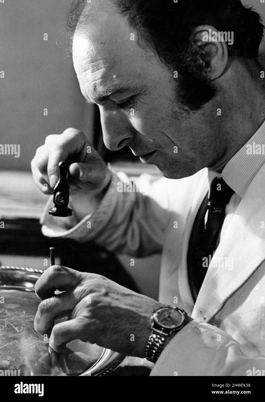 Philip Moody, chaser and embosser, pictured at workin his workshop ...