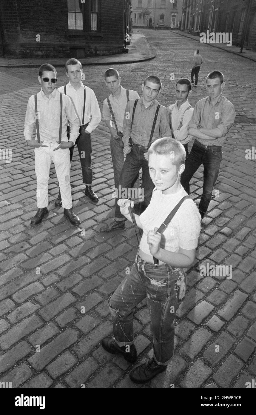 Seventeen year old skinhead teenager Janet Askham poses in the street ...