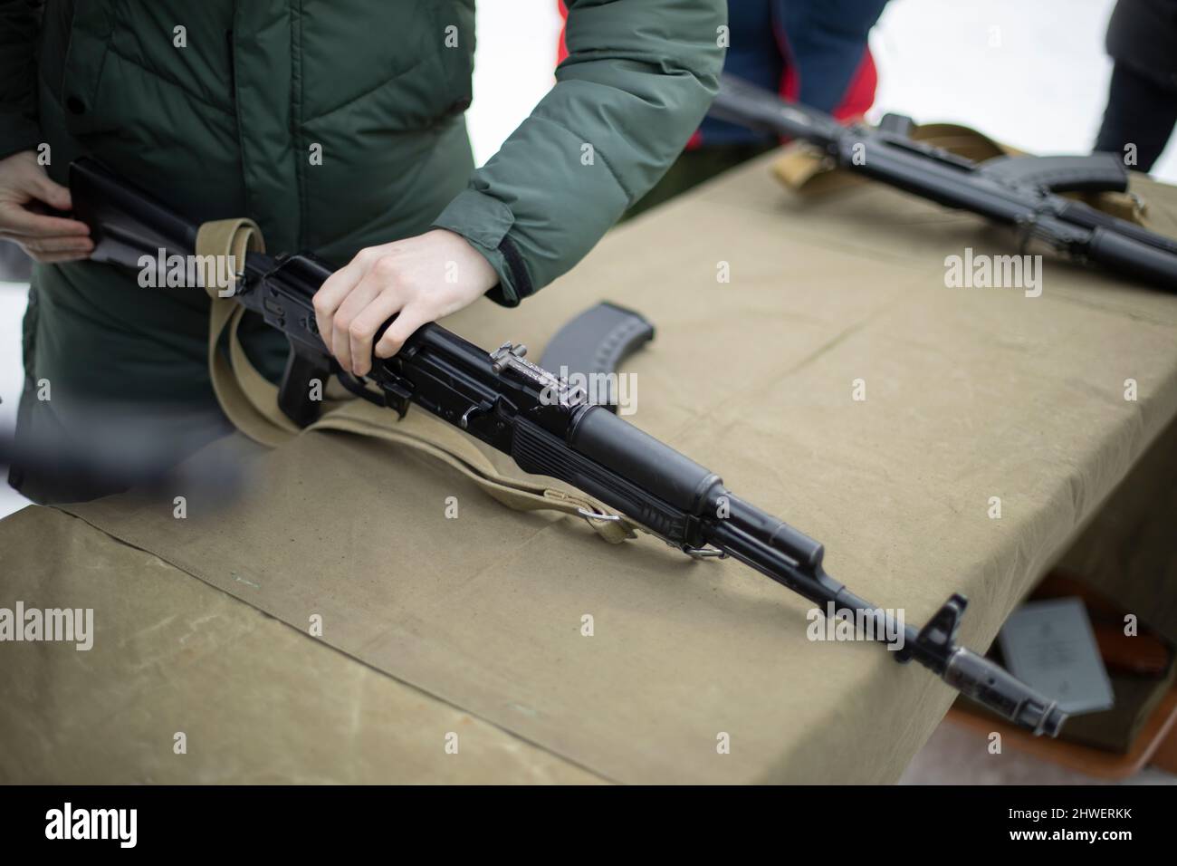 Cleaning Firearms Military Lesson in Russia. Children learn to wield ...