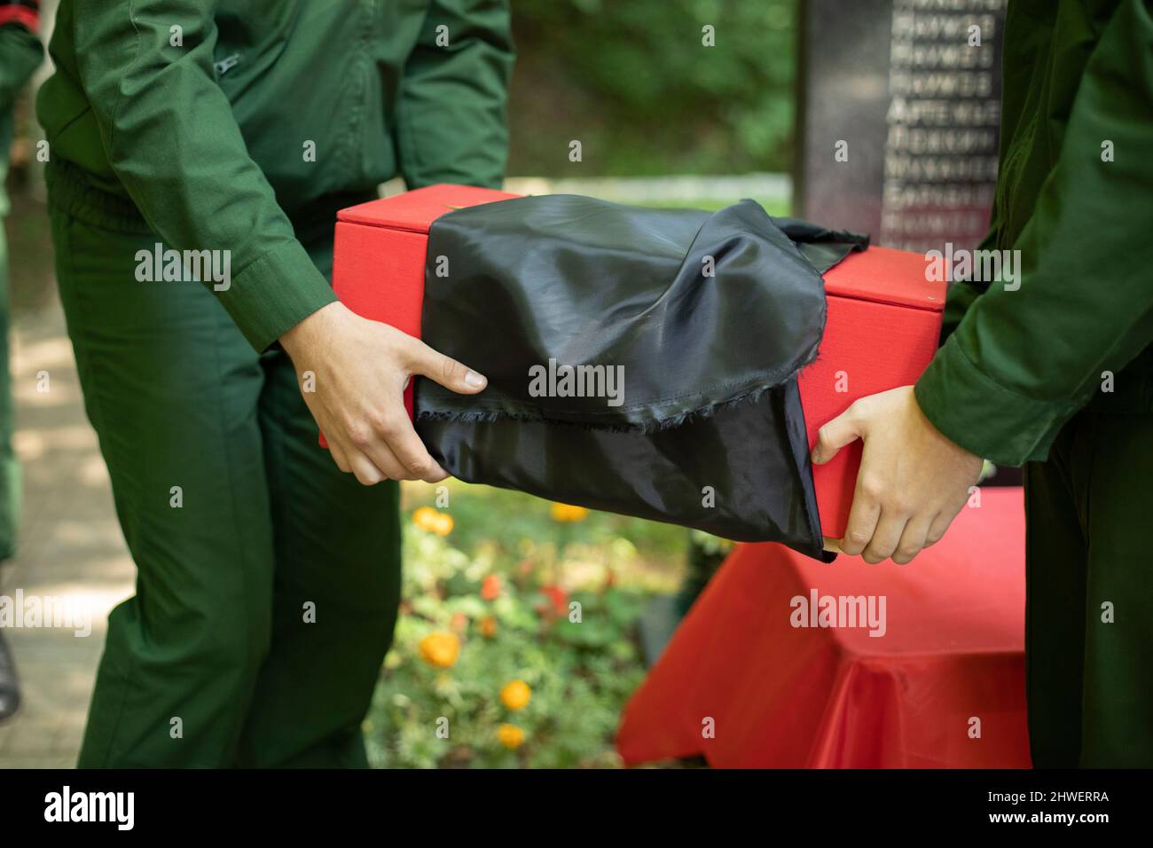 Burial of remains of soldier. Burial ceremony of war hero. Black ...