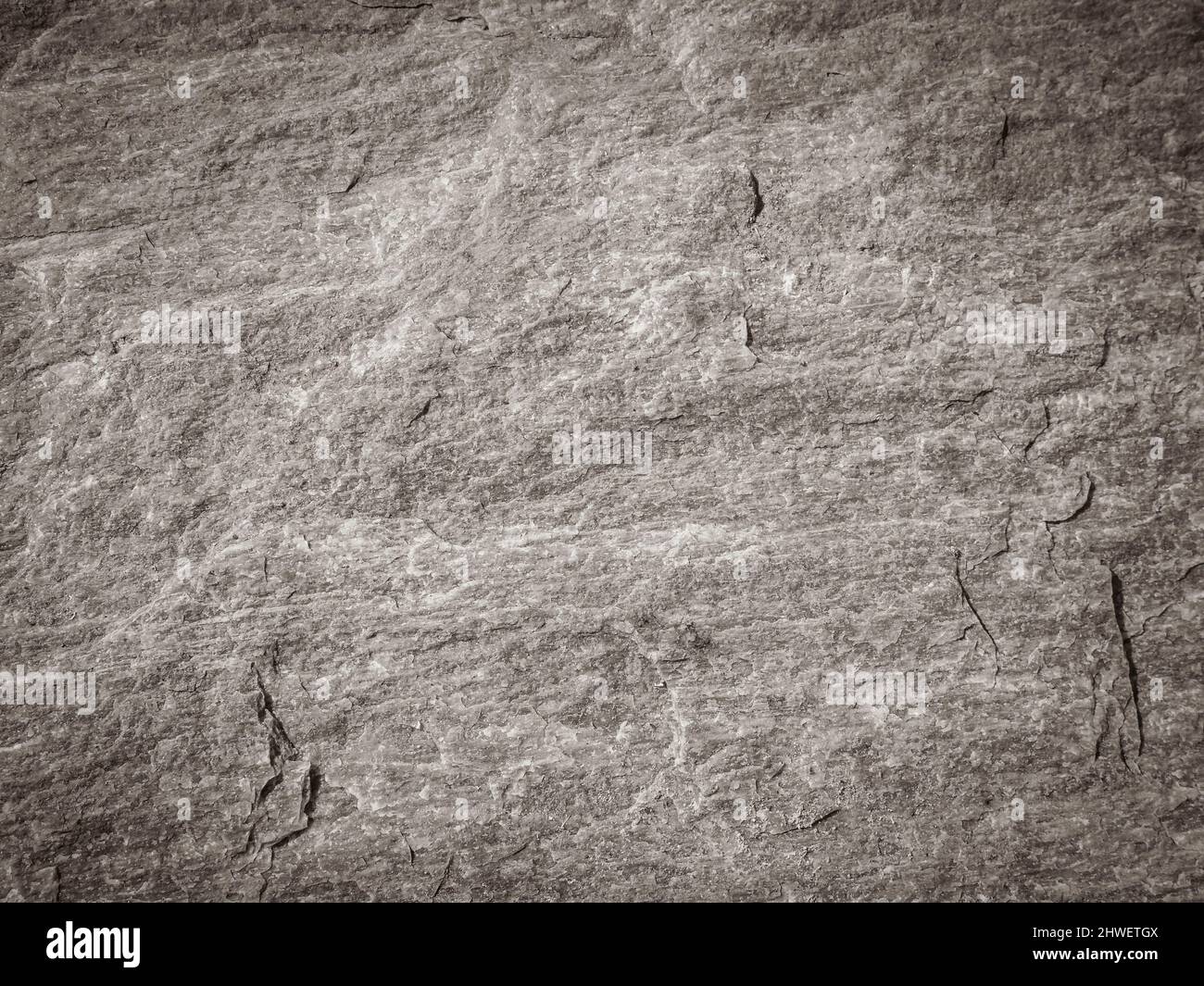 Old black and white picture of a stone rock wall texture with orange ...