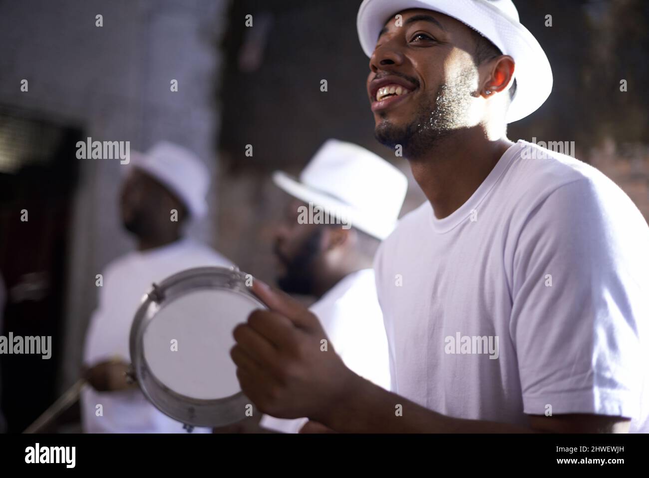 Bringing Brazil to life with their beats. Shot of a band playing their ...