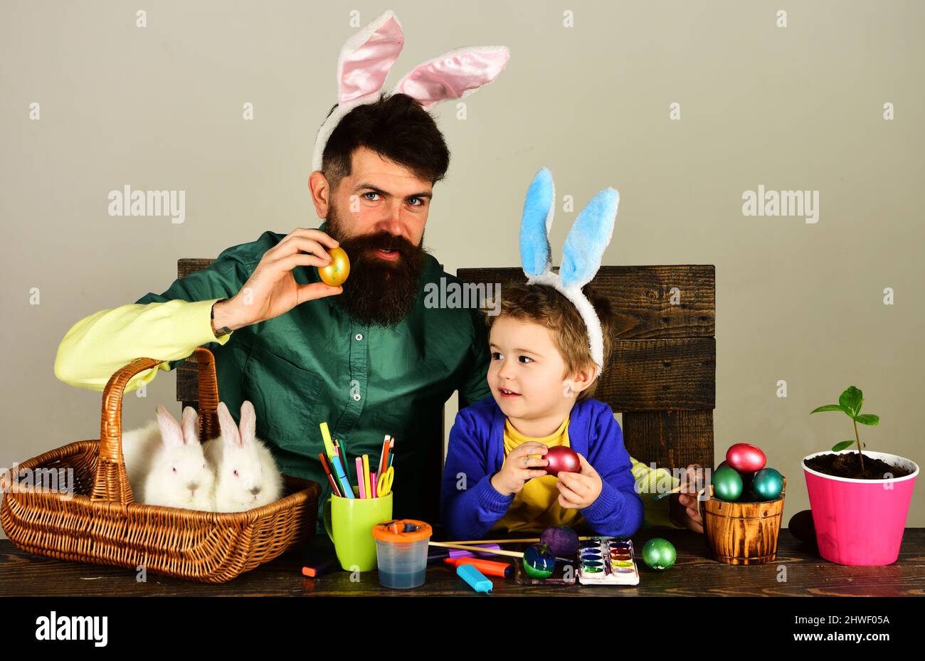 Easter egg decorating. Father and son painting eggs for holiday. Happy ...