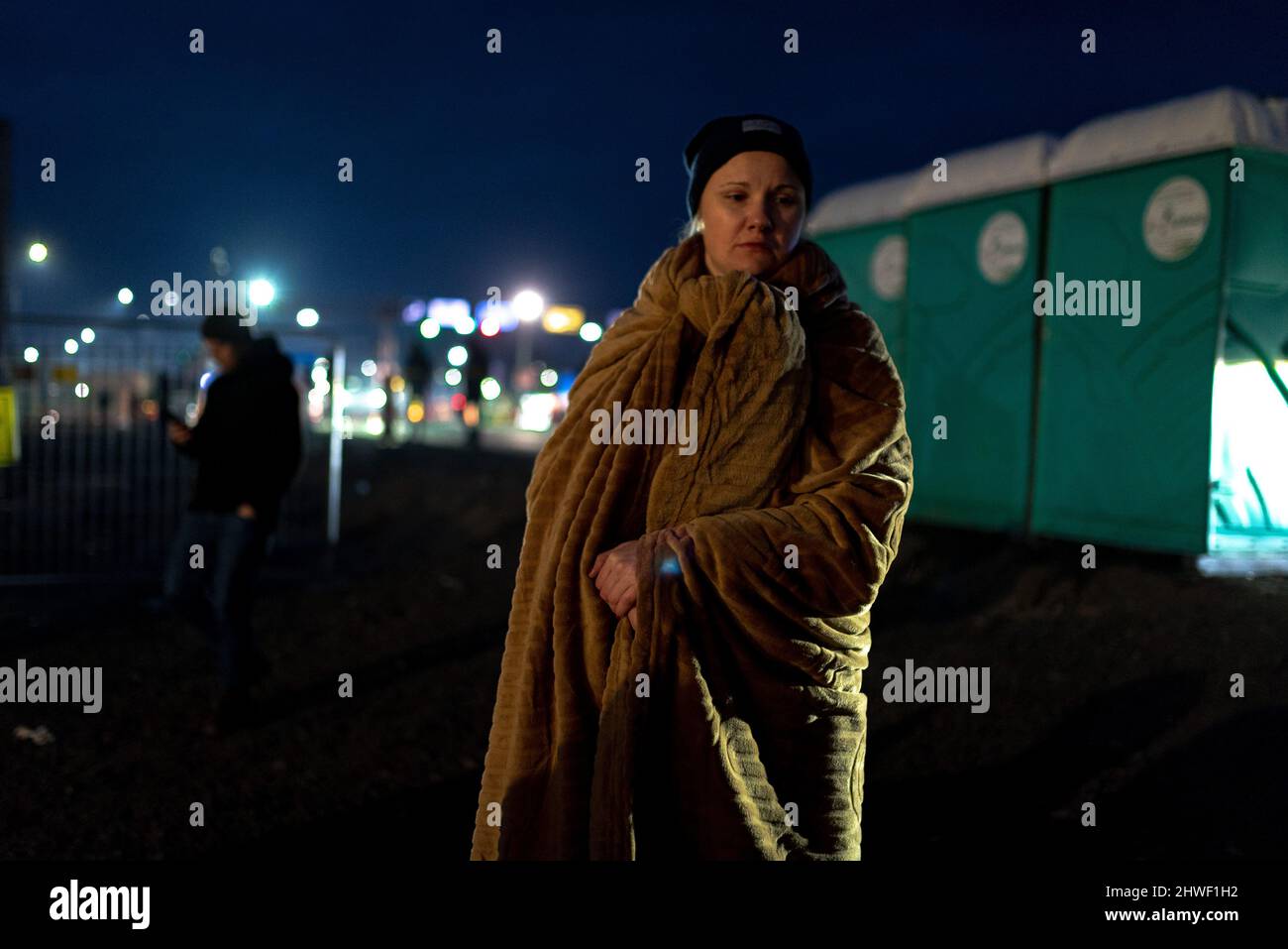 Spain. 04th Mar, 2022. A young refugee woman is seen crying at a border ...