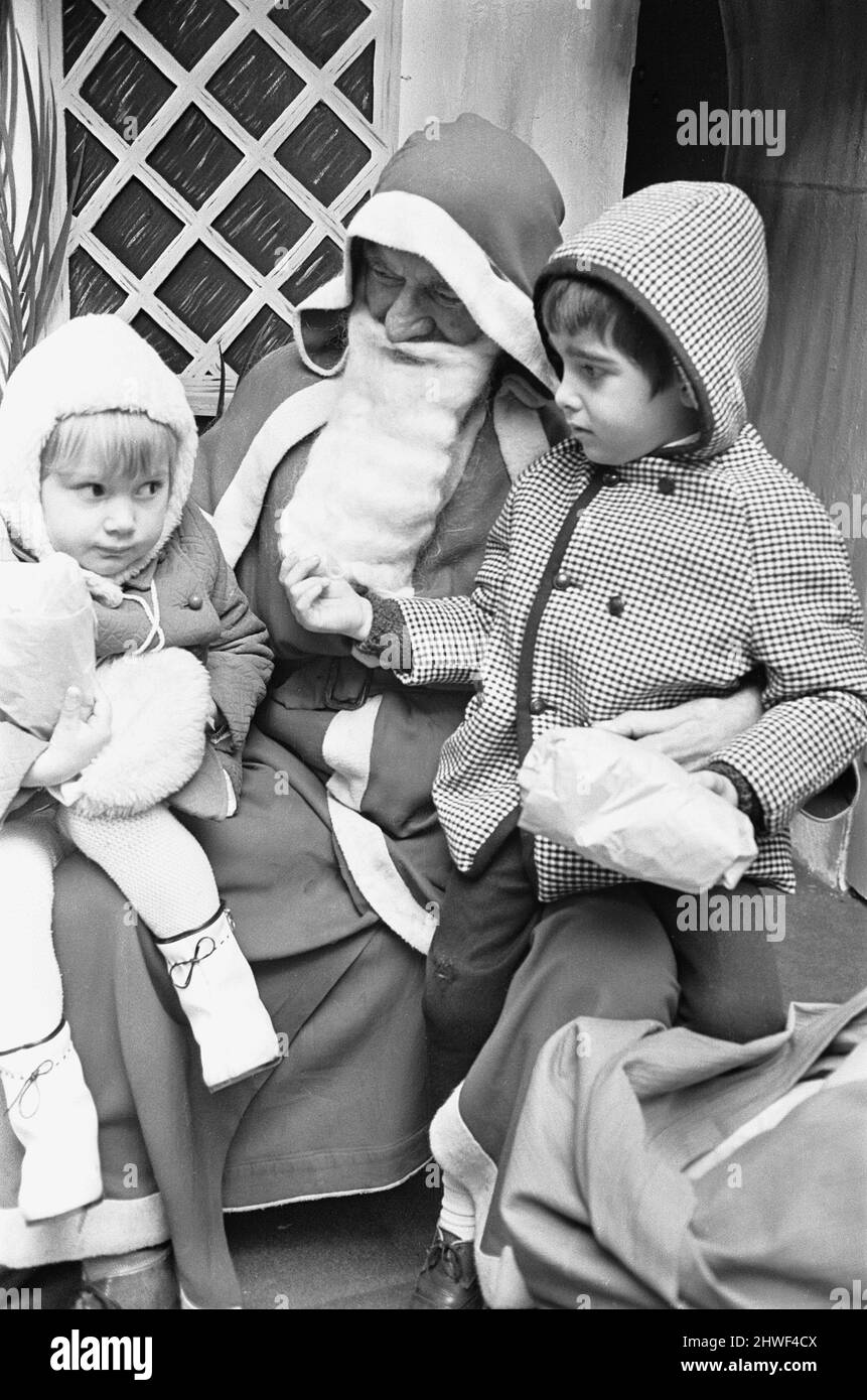 As her brother checks out Santa Claus's beard in Wellsteed department ...