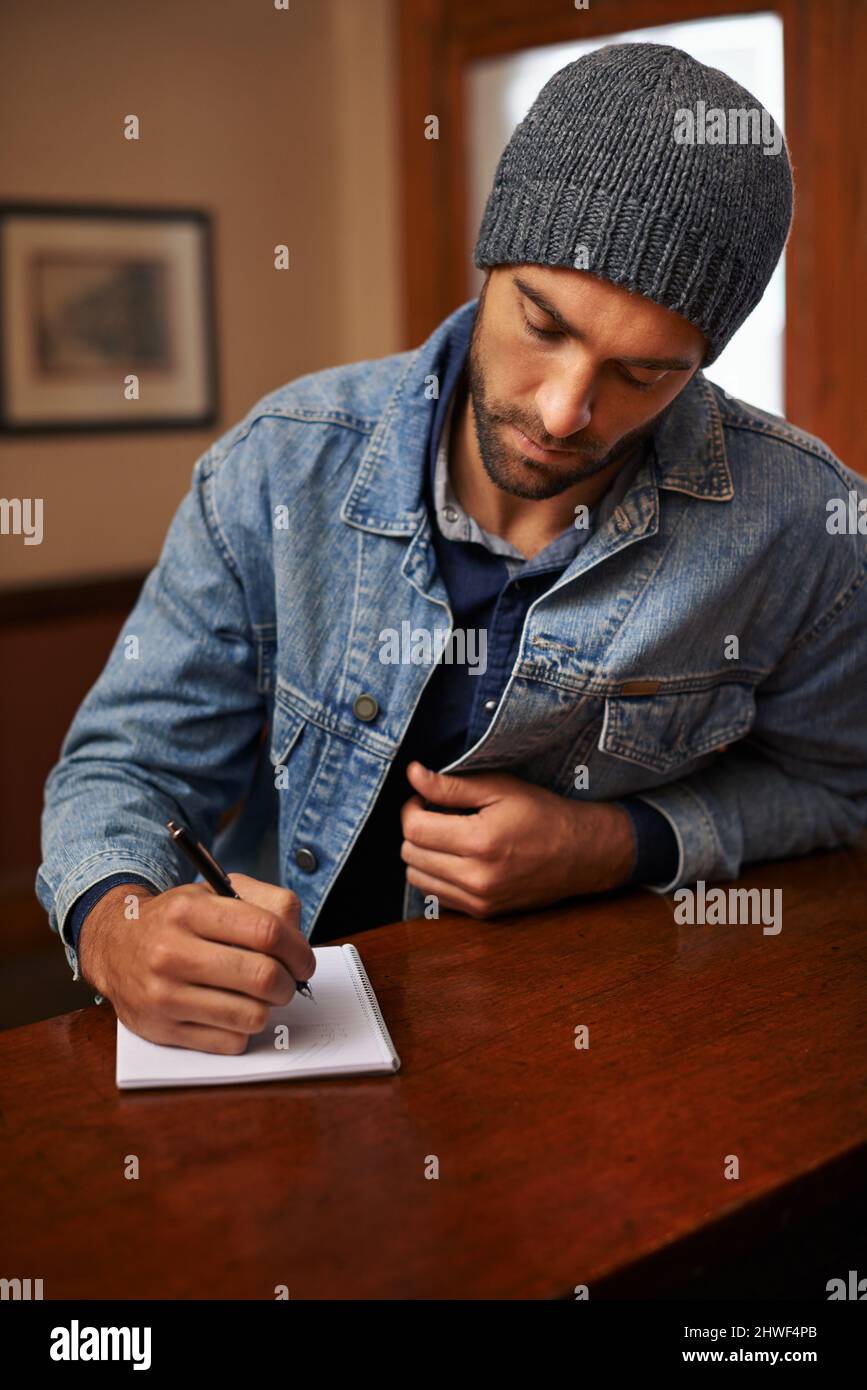 Shell love this poem. Shot of a handsome young man sitting at the bar ...