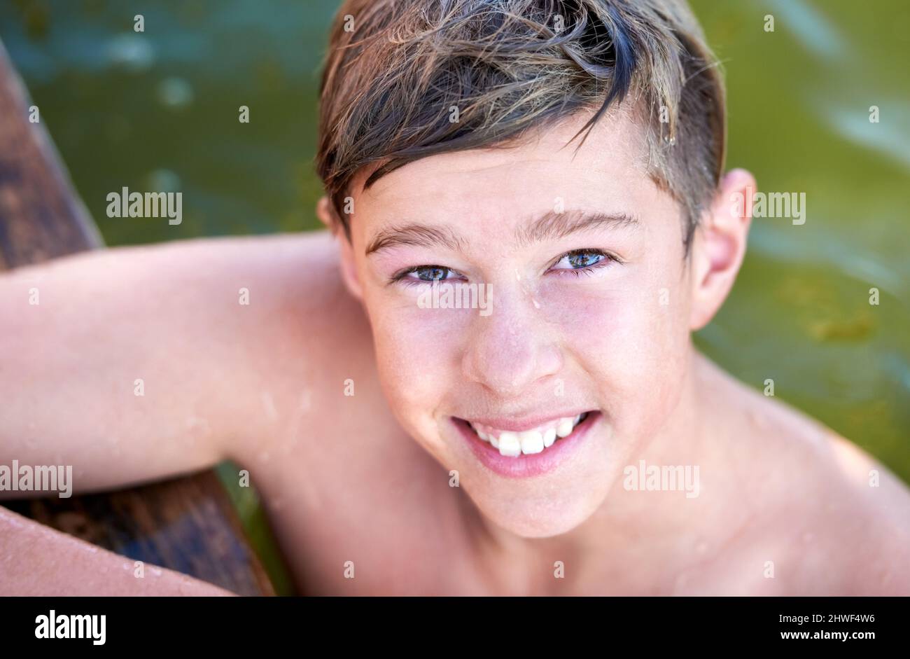 Simple joys. Portrait of a teenage boy having a swim in a lake Stock ...