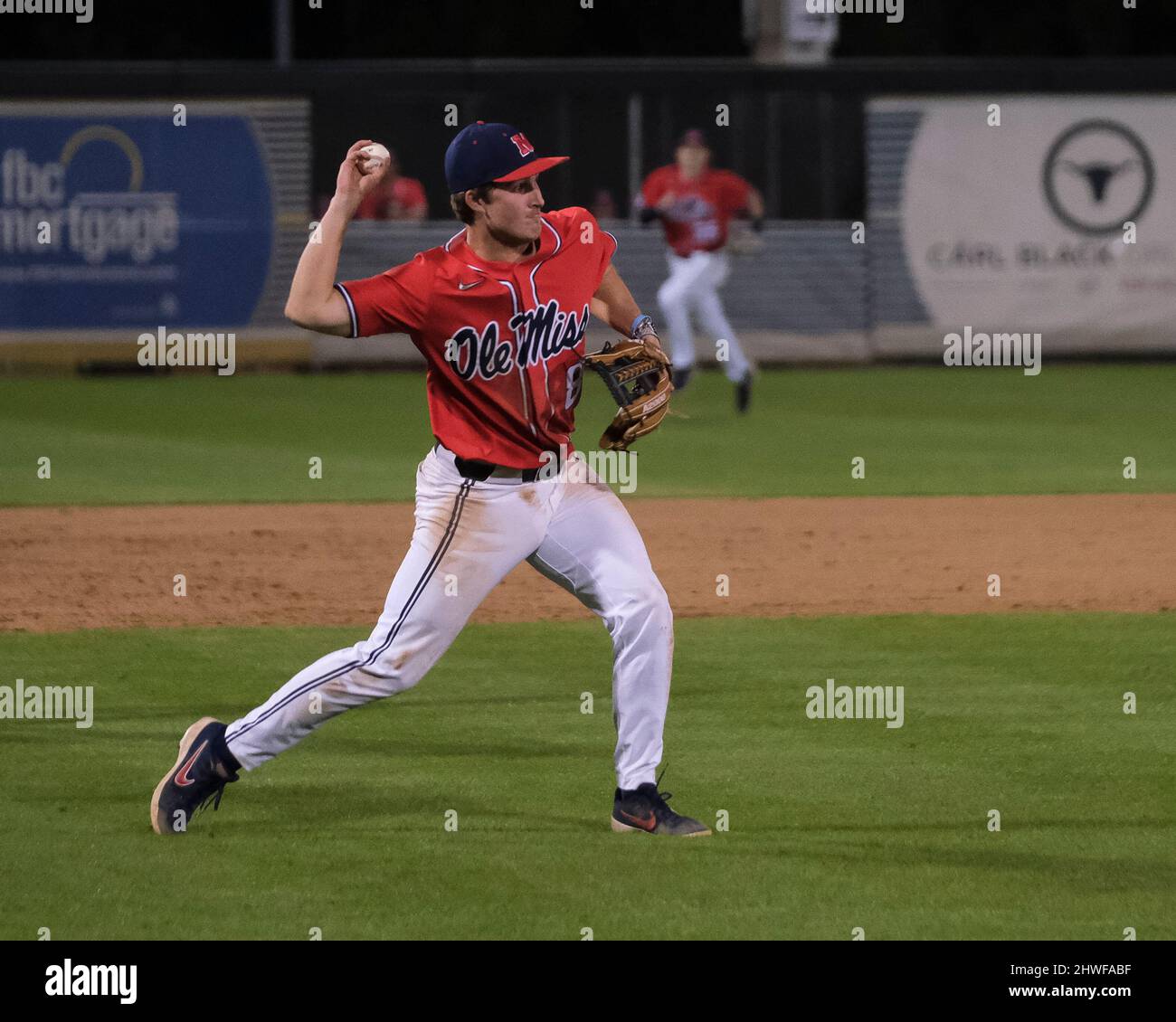 MARCH 05, 2022: Ole Miss Third Baseman Justin Bench (#8) fields a ...