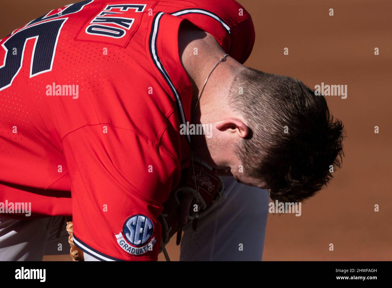 MARCH 05, 2022: Ole Miss First Baseman Tim Elko (#25) prays before the ...