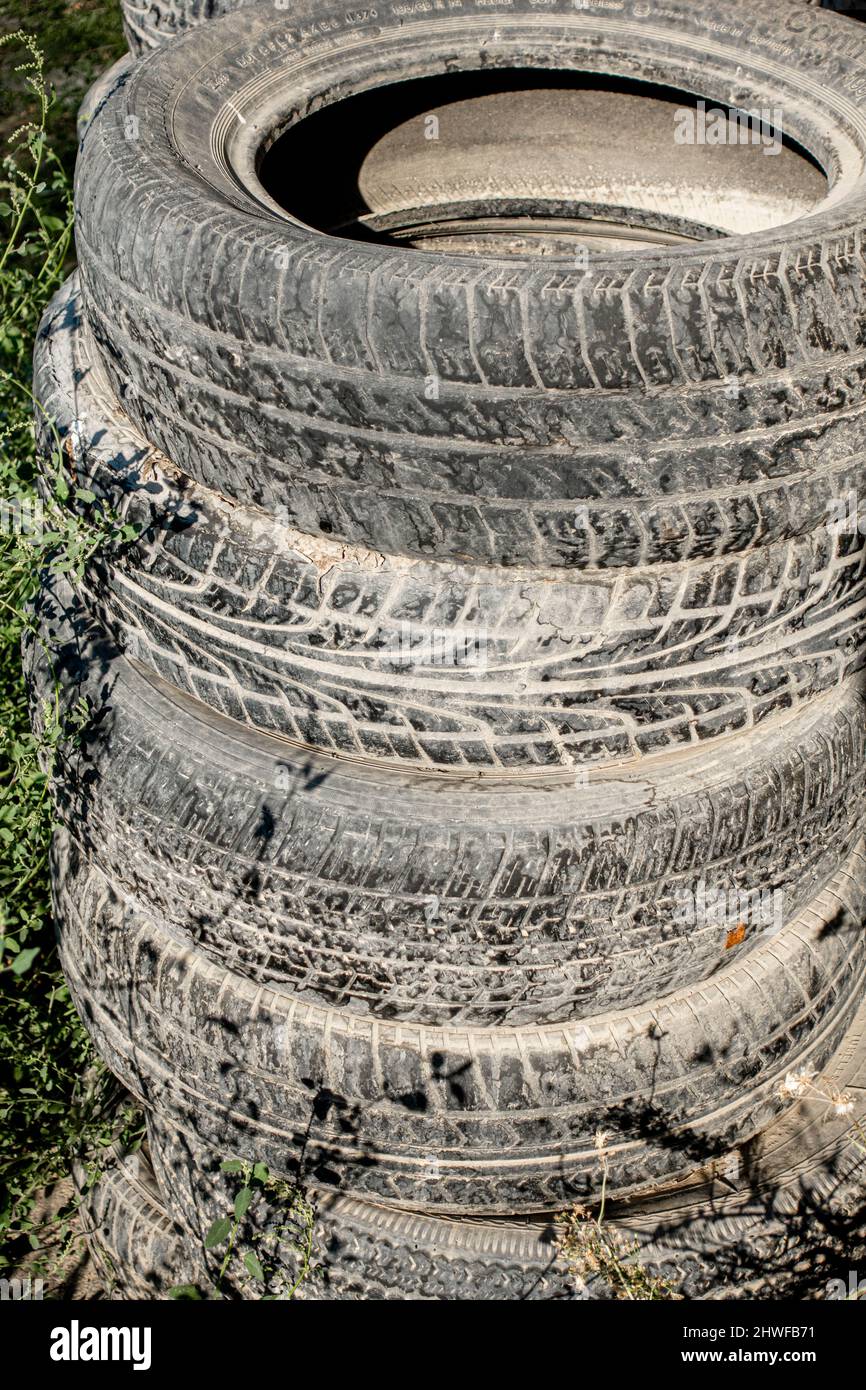 Stacks of old dusty tires o nthe ground Stock Photo - Alamy