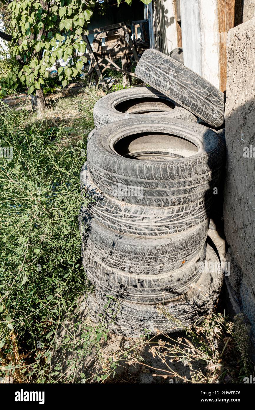Stacks of old dusty tires o nthe ground Stock Photo - Alamy