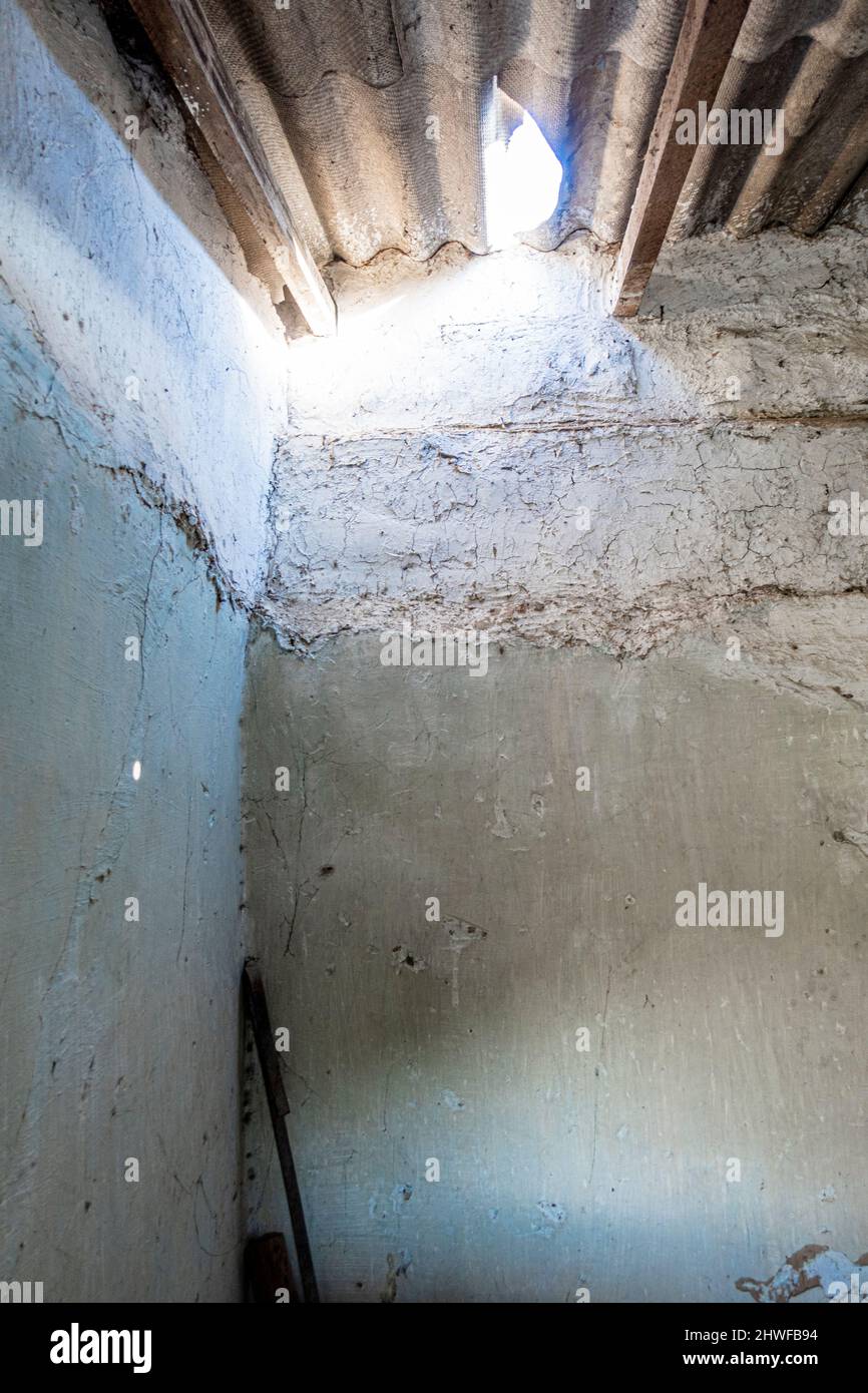 bright light pouring through the crack hole in slated roof Stock Photo ...