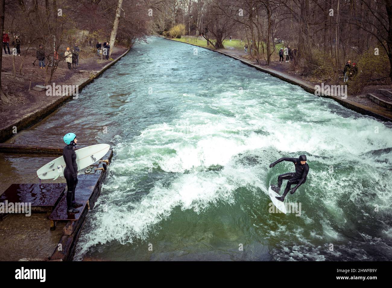 Munich, Germany, 27.02.2022: Winter river surfing on sunny day on ...