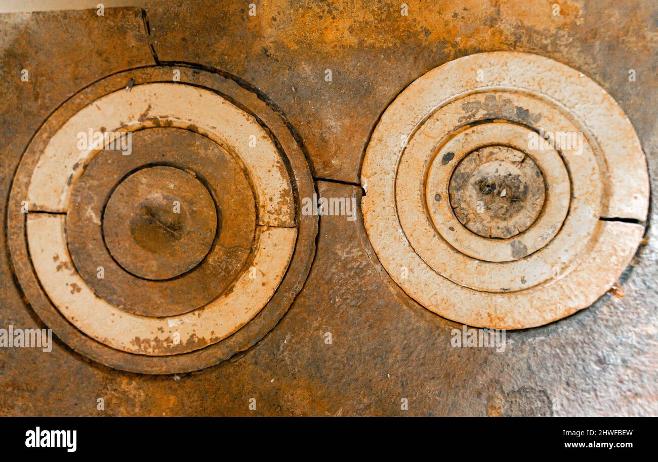 Old rusty oven heat by fire, with two round cooking places Stock Photo ...
