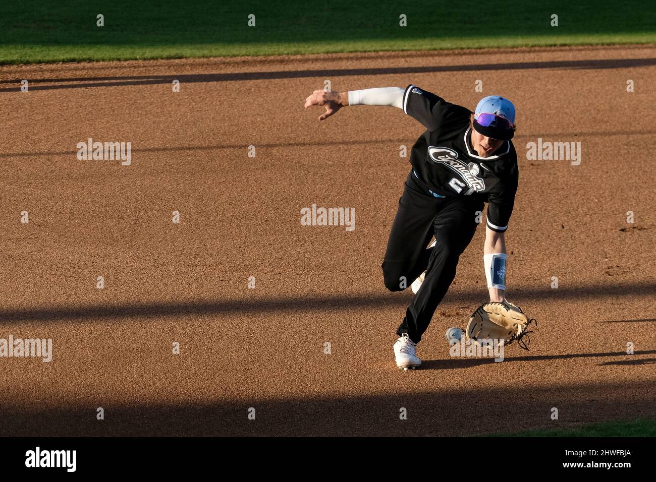MARCH 05, 2022: UCF Third Baseman Noah Orlando (#21) fields a ball at ...