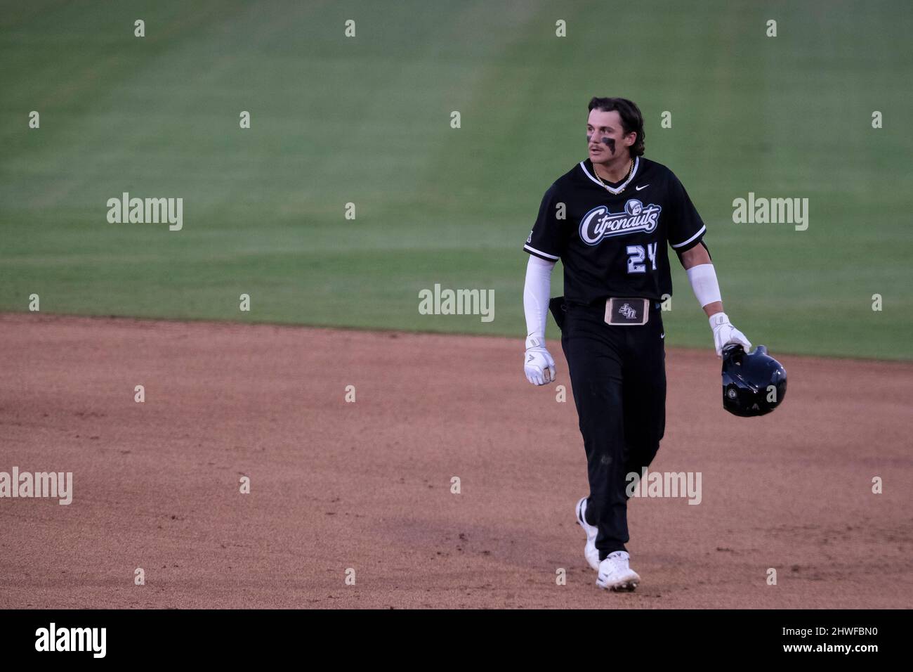 MARCH 05, 2022: UCF Shortstop Alex Freeland (#24) walks off the field ...
