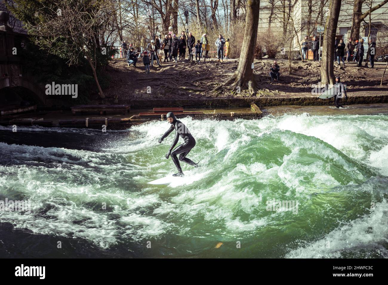 Munich, Germany, 27.02.2022: Winter river surfing on sunny day on ...