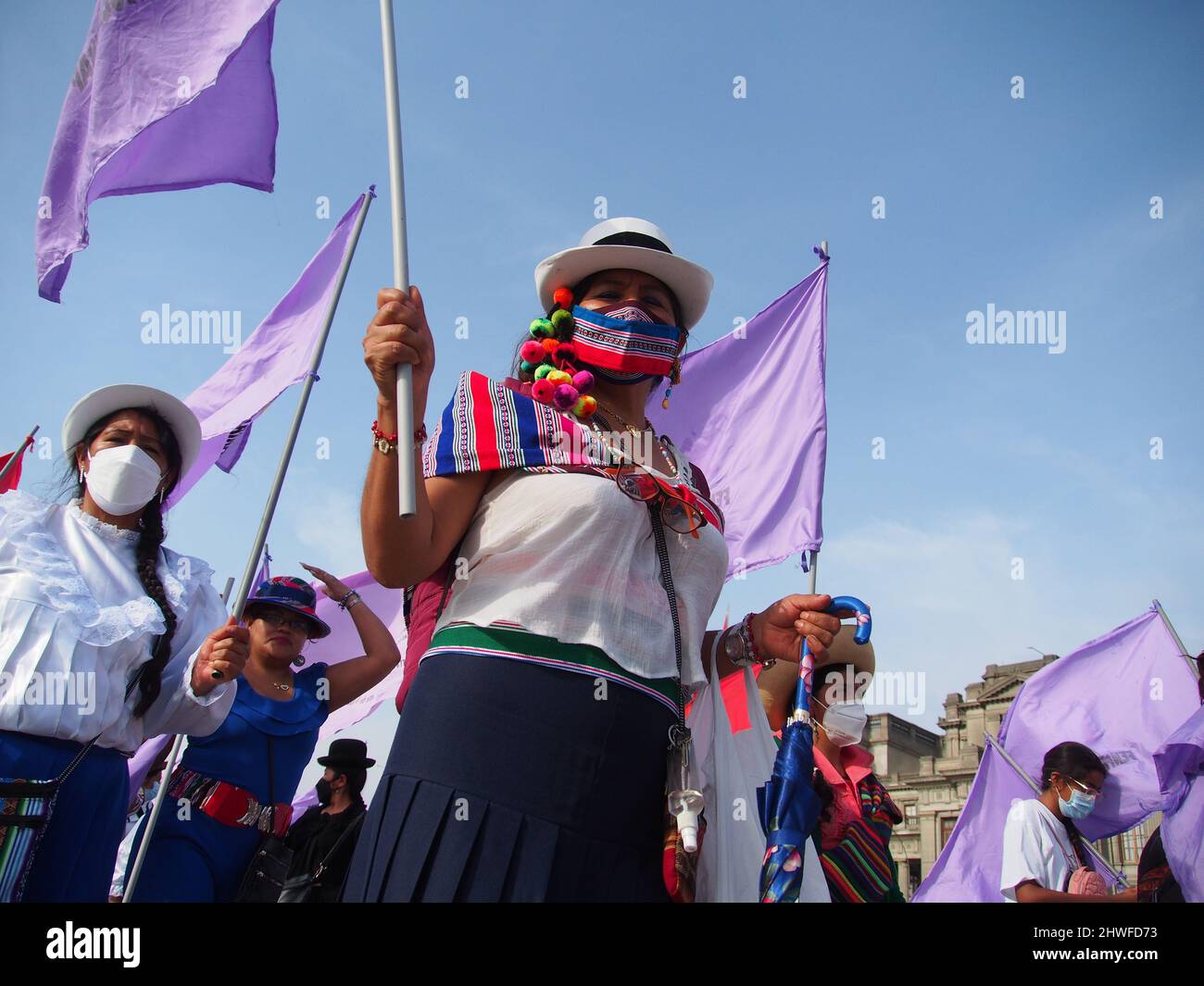 Lima, Peru. 05th Mar, 2022. Indigenous women carrying feminist flags ...