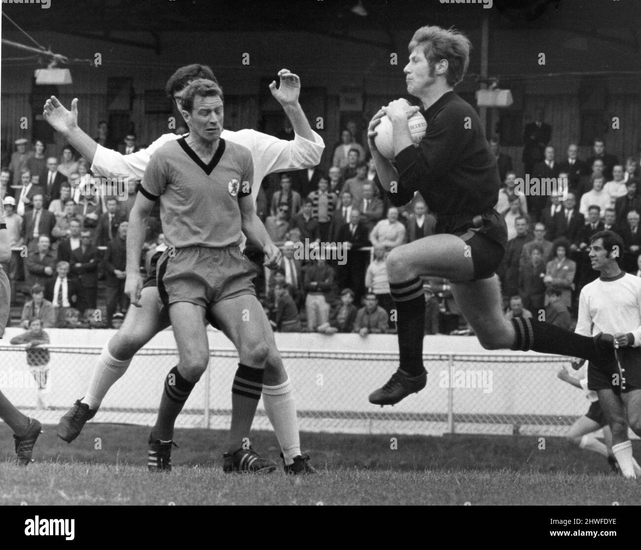 Donald MacKay Dundee United goalkeeper catches the ball as team mate ...