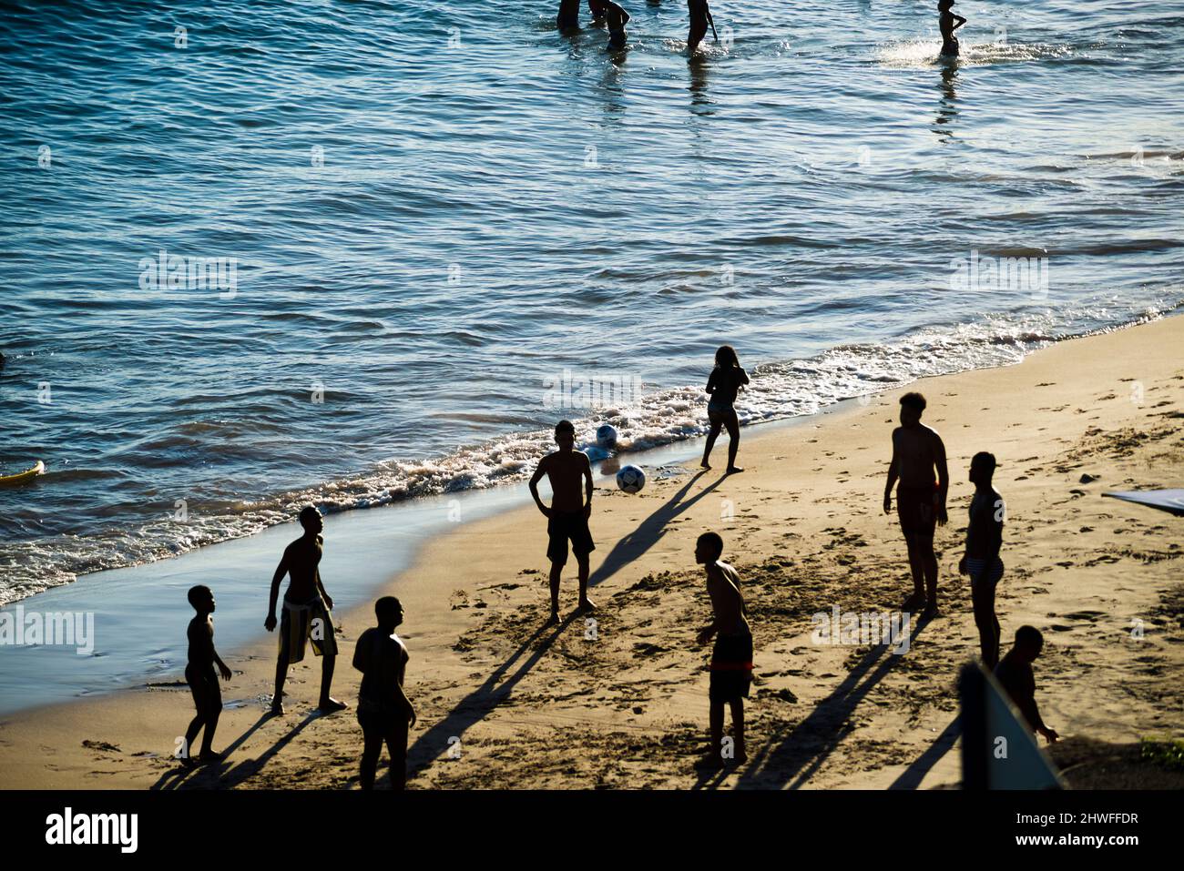 Large group of people on the beach in a bright sunny day in the city of ...