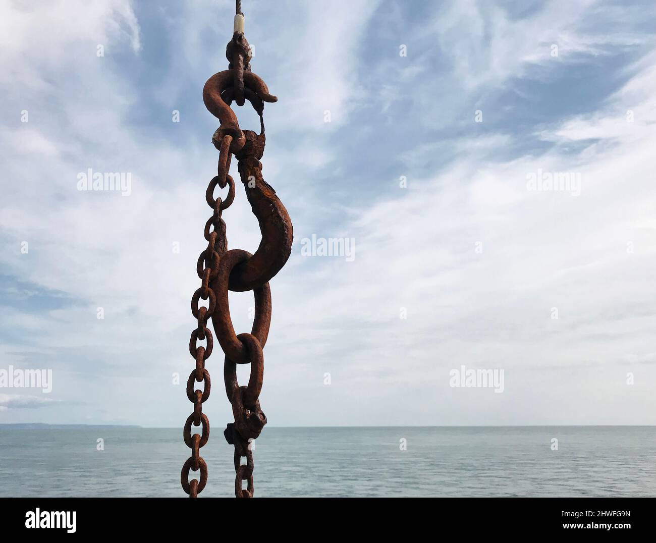 Rusty chains and hook Stock Photo - Alamy