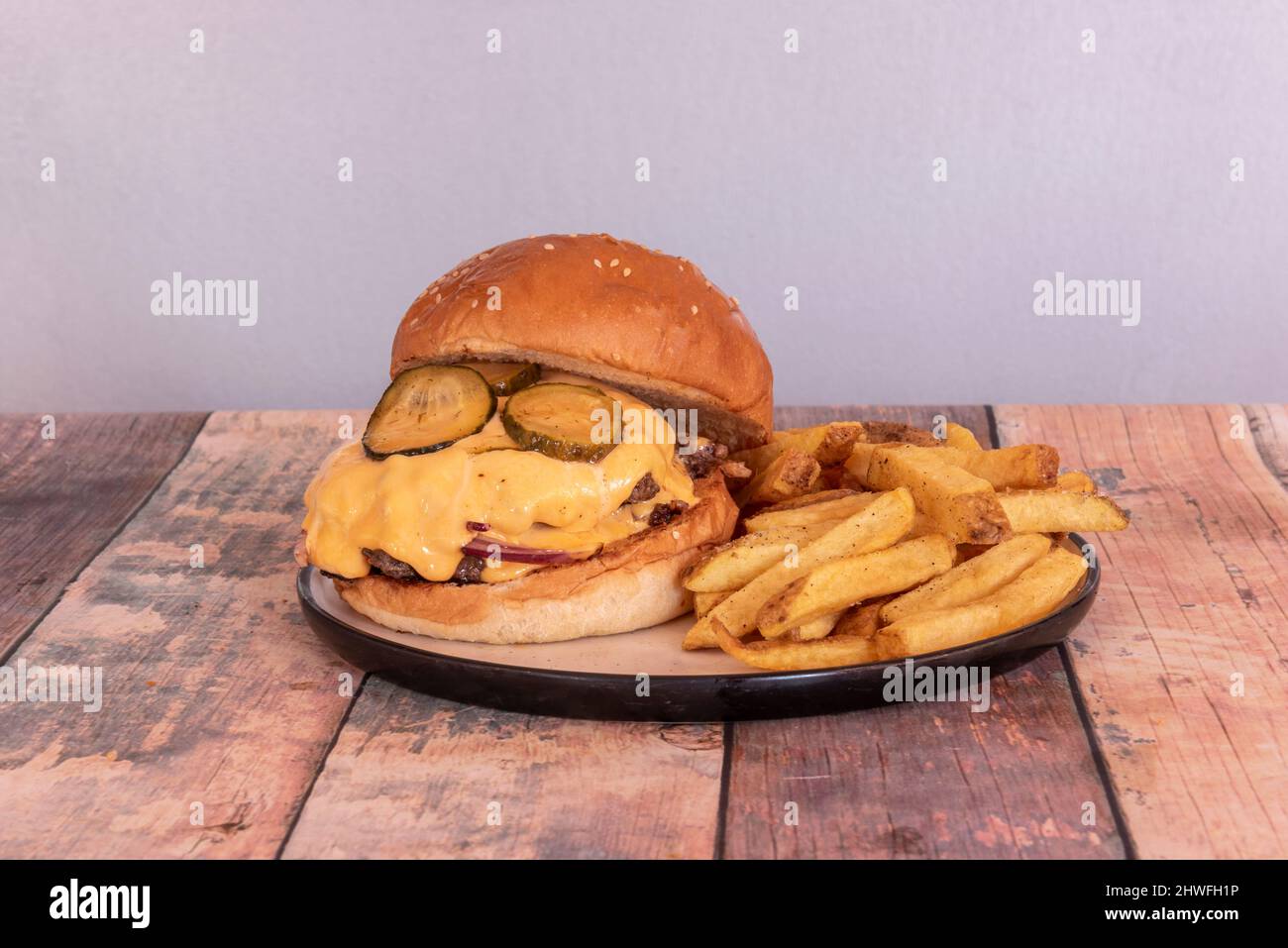 A cheeseburger is a hamburger that contains a few slices of slightly ...