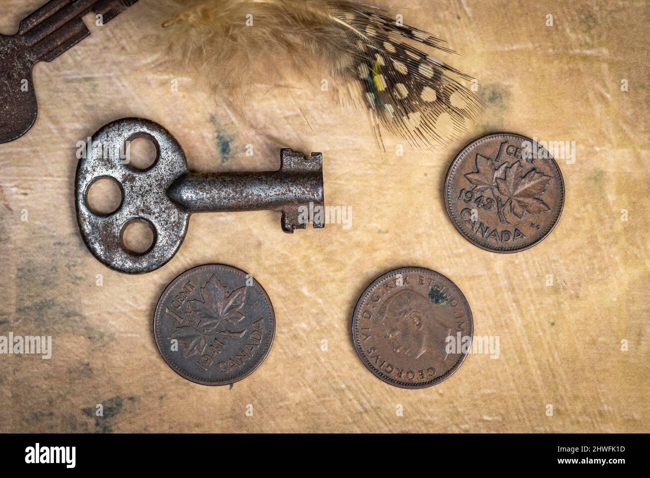 Key, Feather and Vintage Canada Copper Pennies Stock Photo - Alamy
