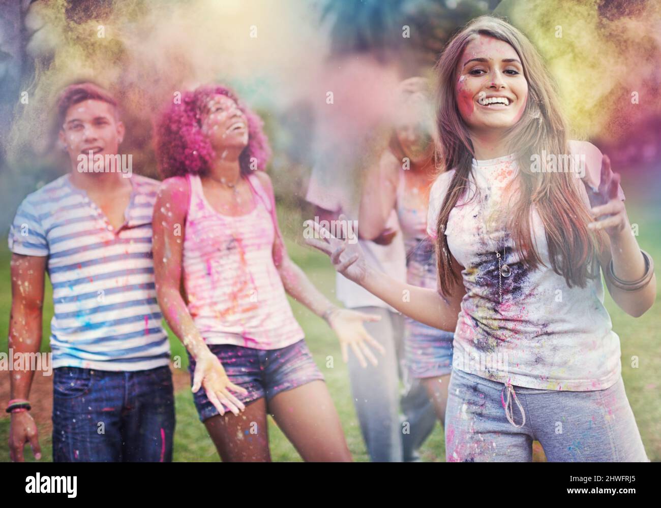 Color me FUN. Shot of happy friends having fun with powder paint Stock ...