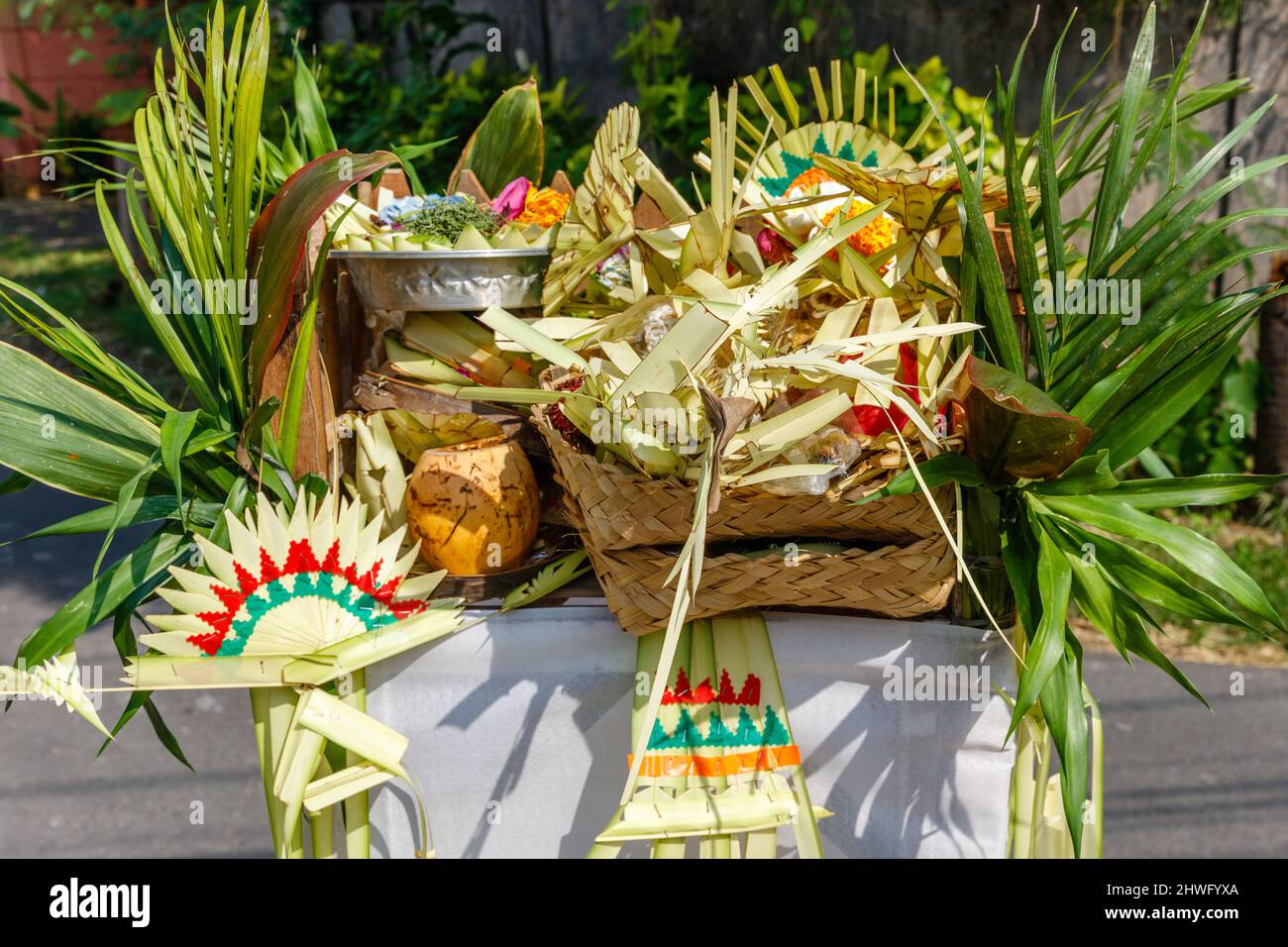 Traditional Balinese offerings for Nyepi celebration on the road along ...