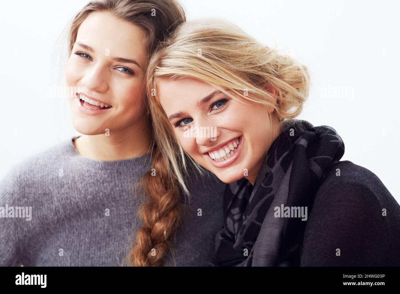 Friends forever. Portrait of two young friends smiling at the camera ...